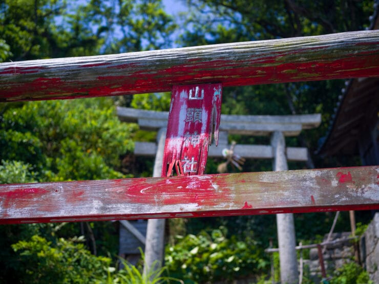 Vibrant Red Japanese Shrine Gate in Lush Nature | Offbeat Japan